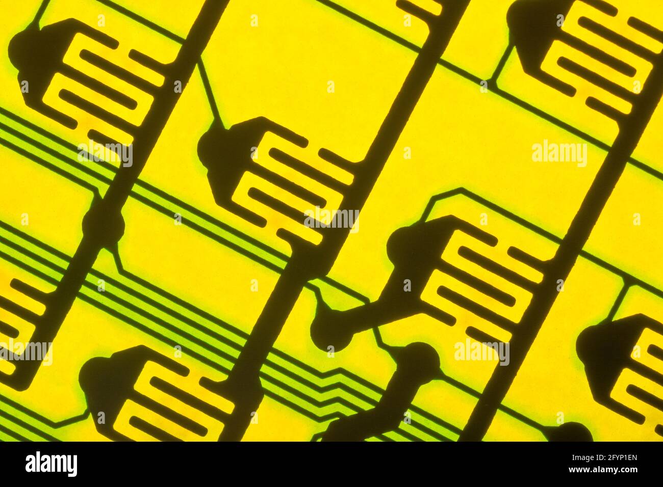 Vibrant coloured abstract macro shot of an opaque printed circuit board ...