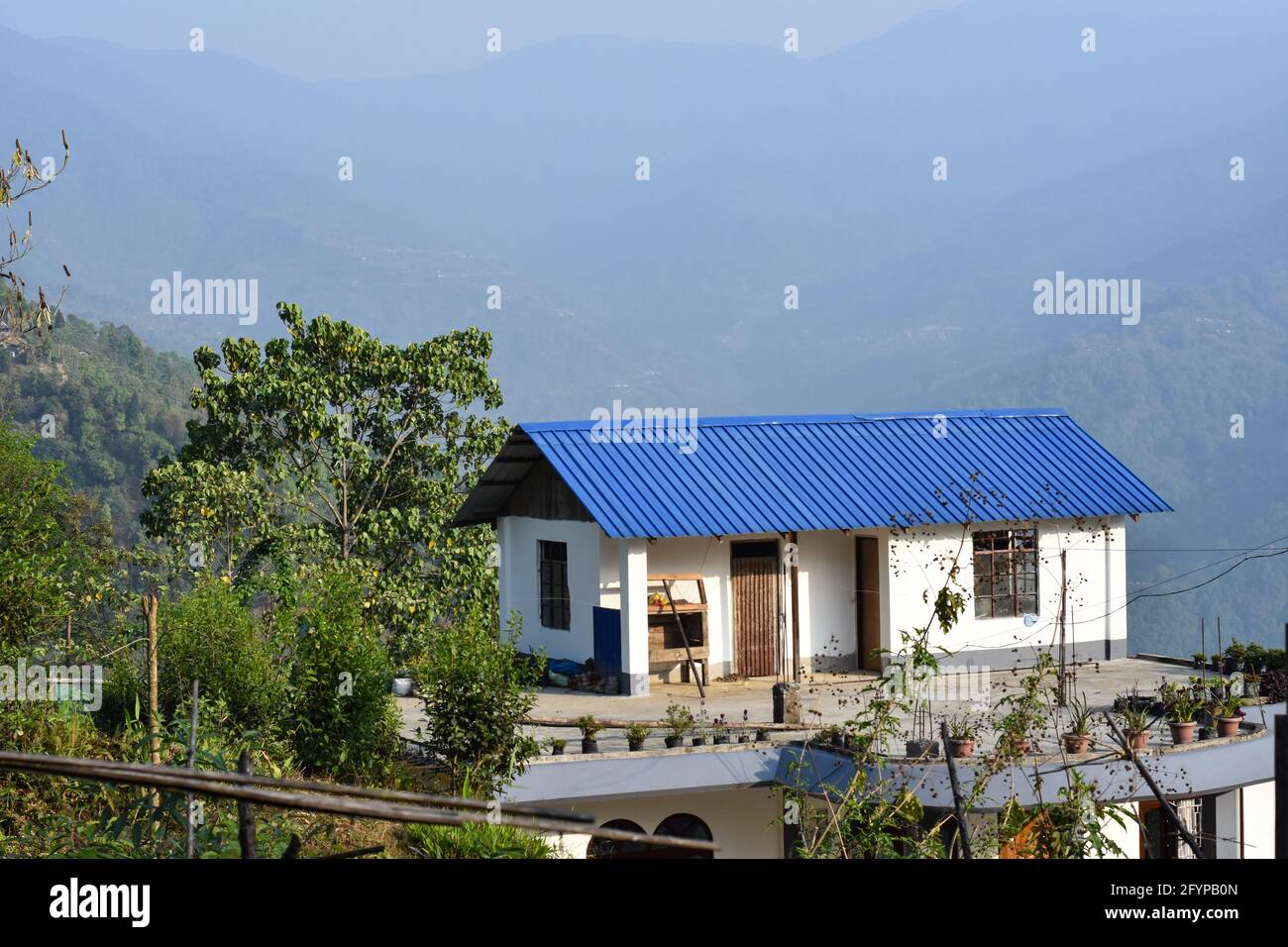 Beautiful cottage with blue roof, scenic remote himalaya village Stock ...