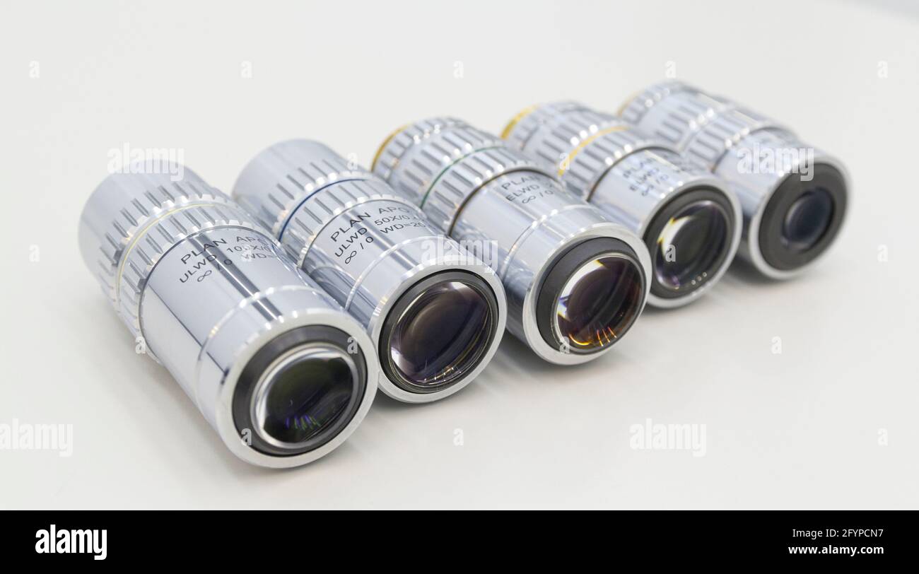 Many of lenses different of magnification on a white background. Close ...