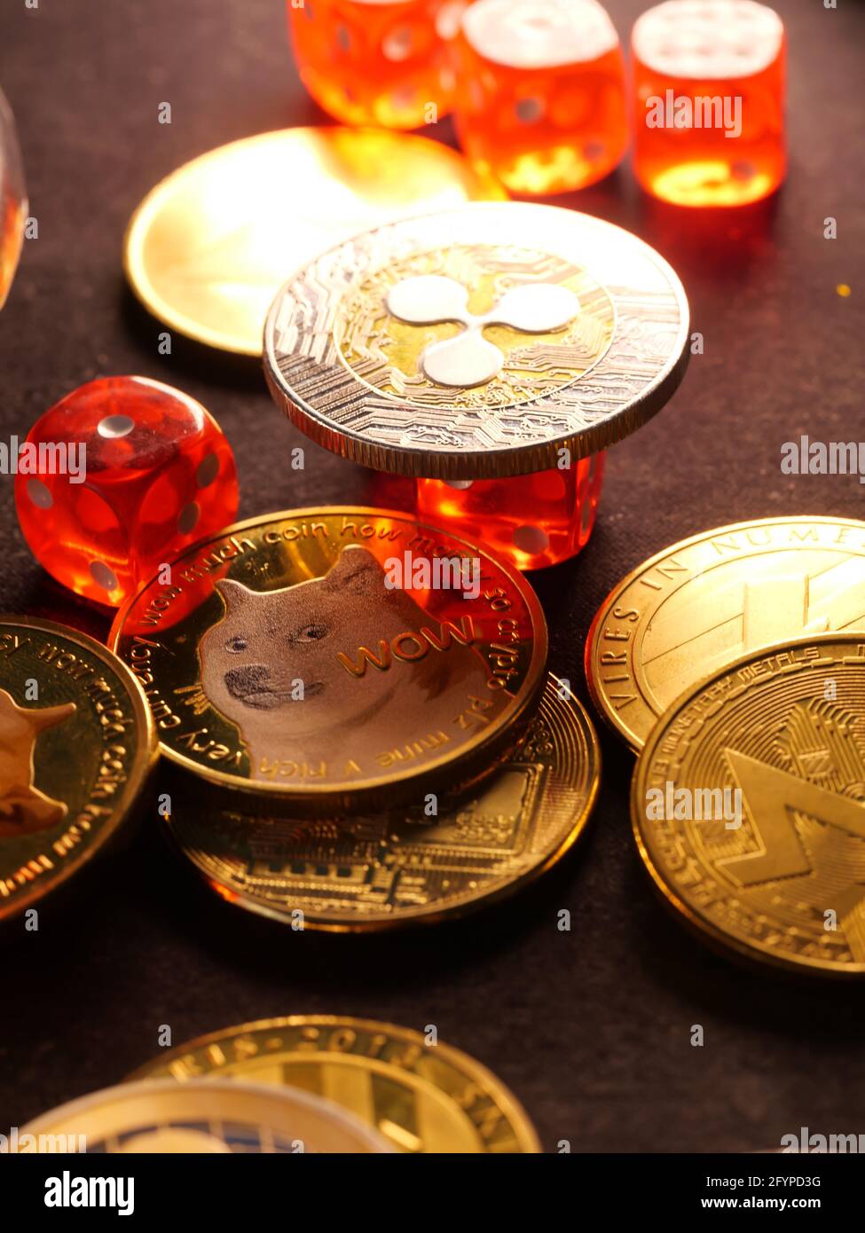 Vertical shot of golden poker chips and dice on the gaming table Stock ...
