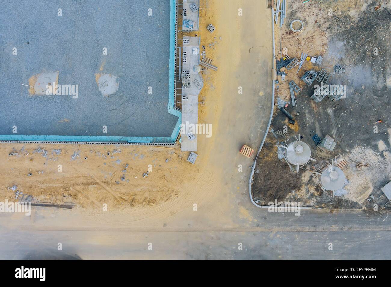 Preparation for a wall construction site, form blocks being filled with ...