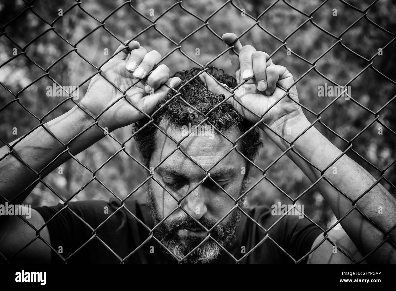 Businessman behind prison bars Black and White Stock Photos & Images ...