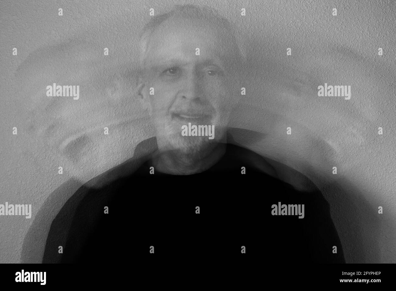 Man with split personalities standing in front of wall Stock Photo - Alamy