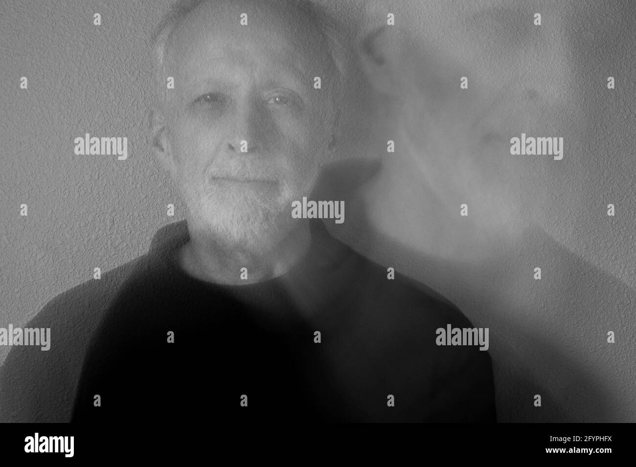 Man with split personalities standing in front of wall Stock Photo - Alamy