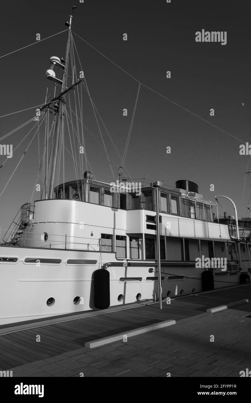 Grayscale vertical shot of a huge ship on a seashore Stock Photo - Alamy