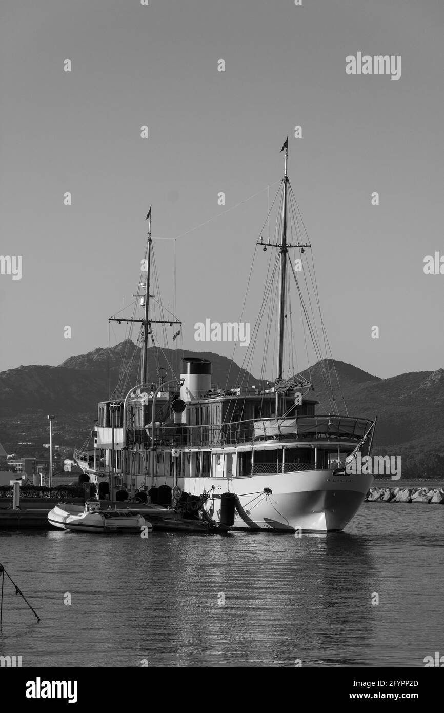 Grayscale, vertical shot of a huge ship in the port Stock Photo - Alamy