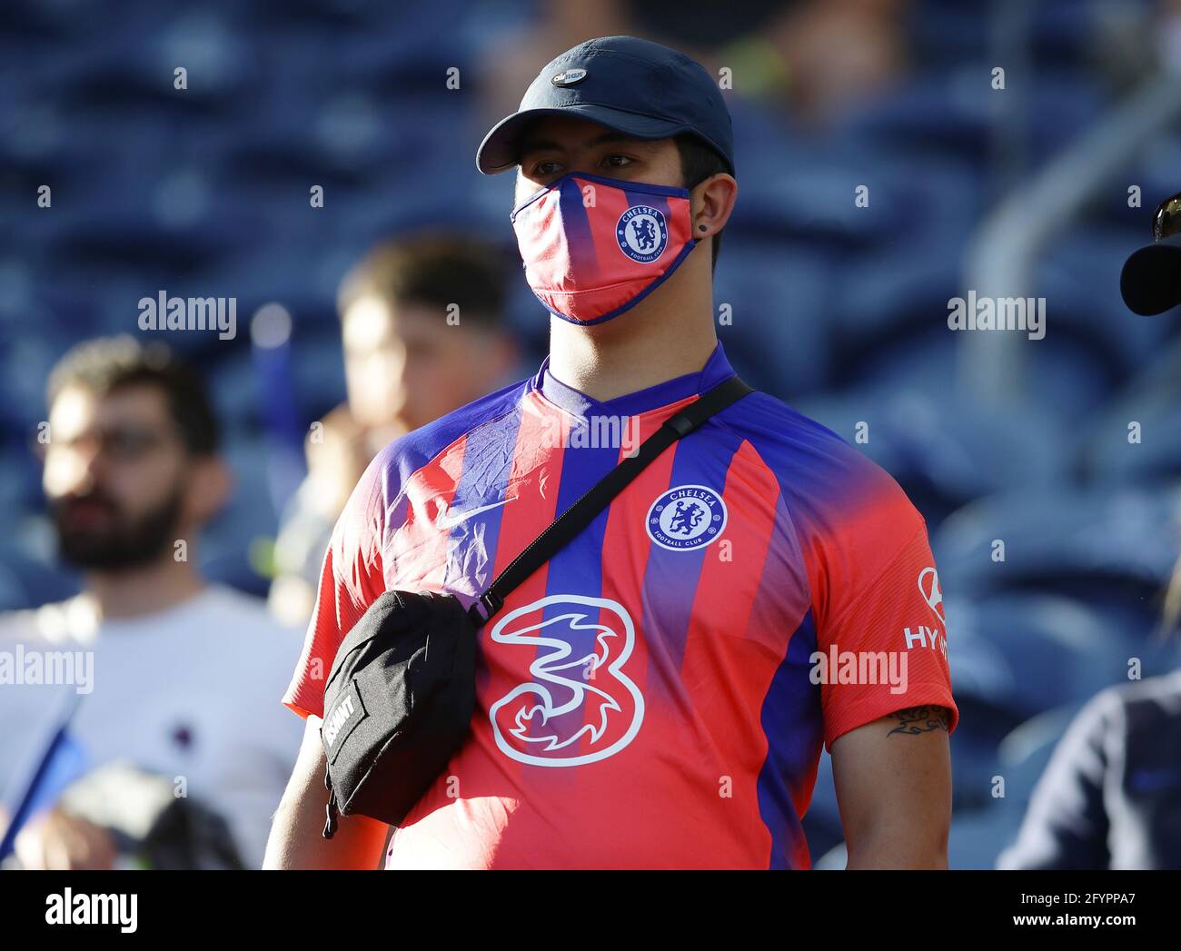Porto, Portugal, 29th May 2021. Chelsea fan in mask watches the teams ...