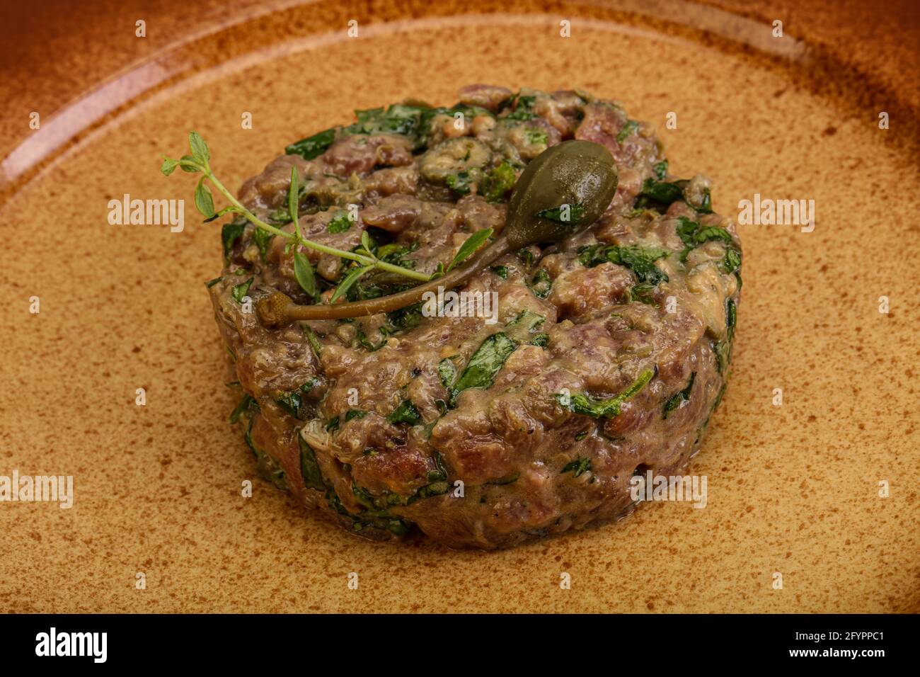 Raw beef tartar snack with capers Stock Photo - Alamy