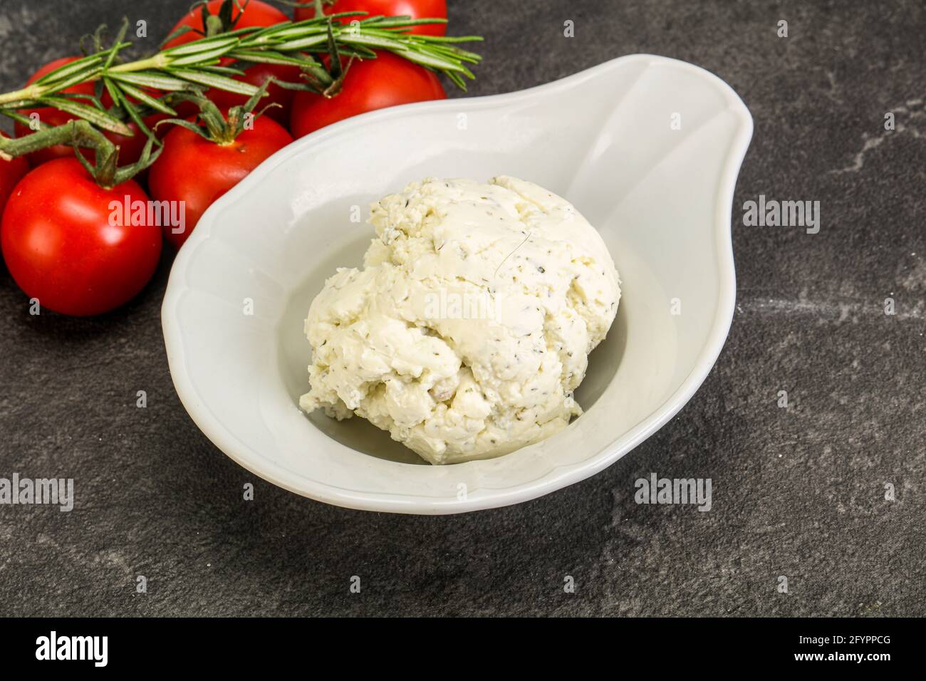 Soft cream cheese with herbs in the bowl Stock Photo - Alamy