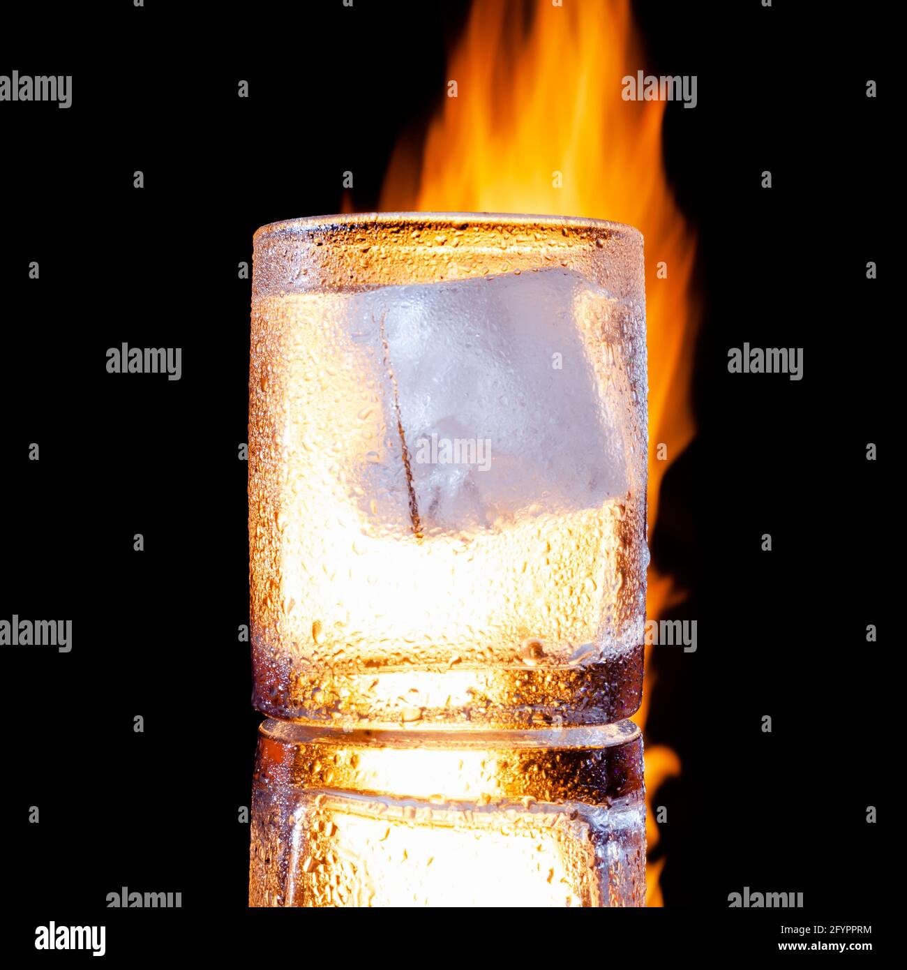 glass of vodka on a black background on fire Stock Photo - Alamy