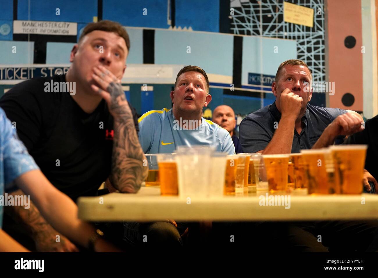 Manchester City fans react at the Mary Ds Pub during the UEFA Champions ...