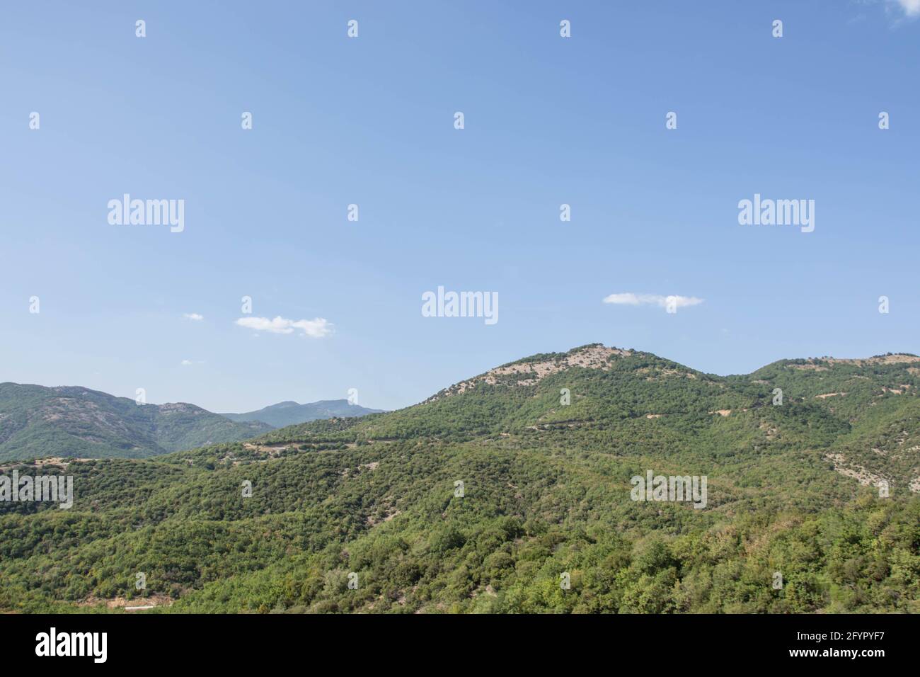 Beautiful Greek mountains and green hills with blue sky. Travel ...