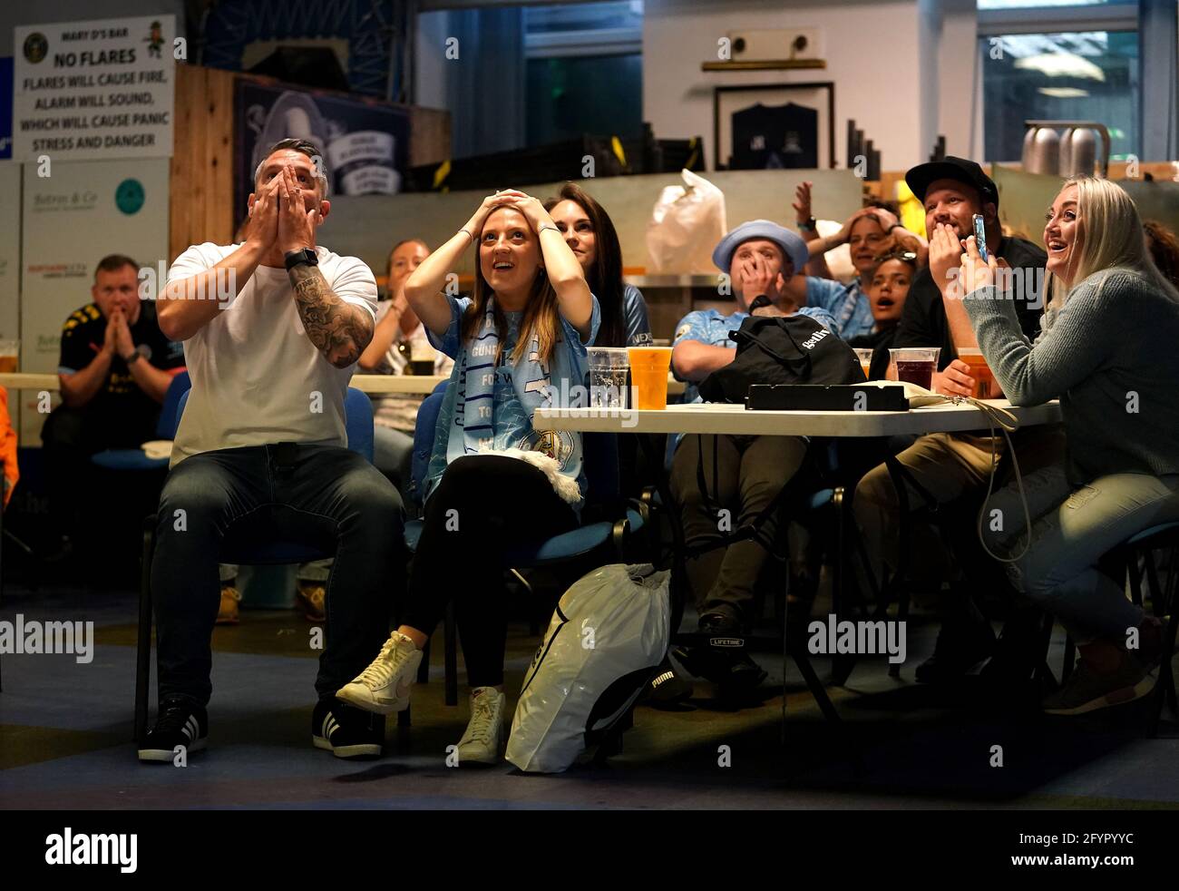 Manchester City fans react at the Mary Ds Pub during the UEFA Champions ...