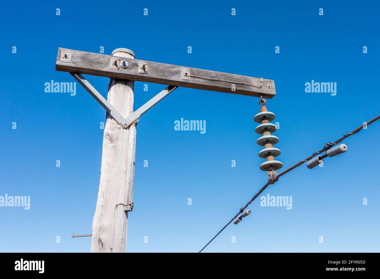 Drone aerial photograph of a telephone pole and wires in a forest ...
