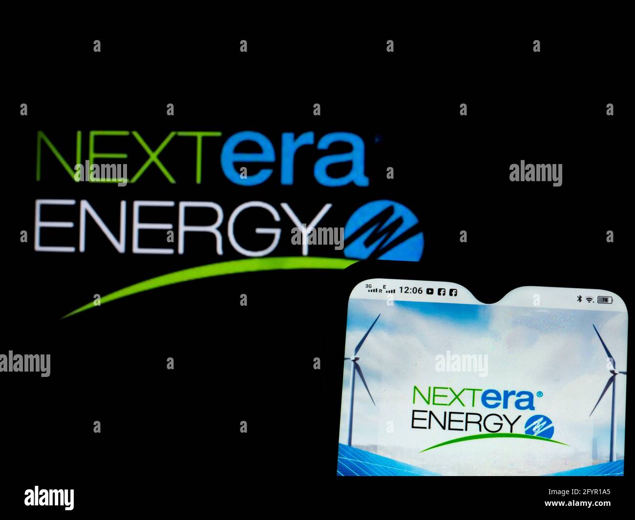 In this photo illustration, a NextEra Energy Inc. logo seen displayed ...