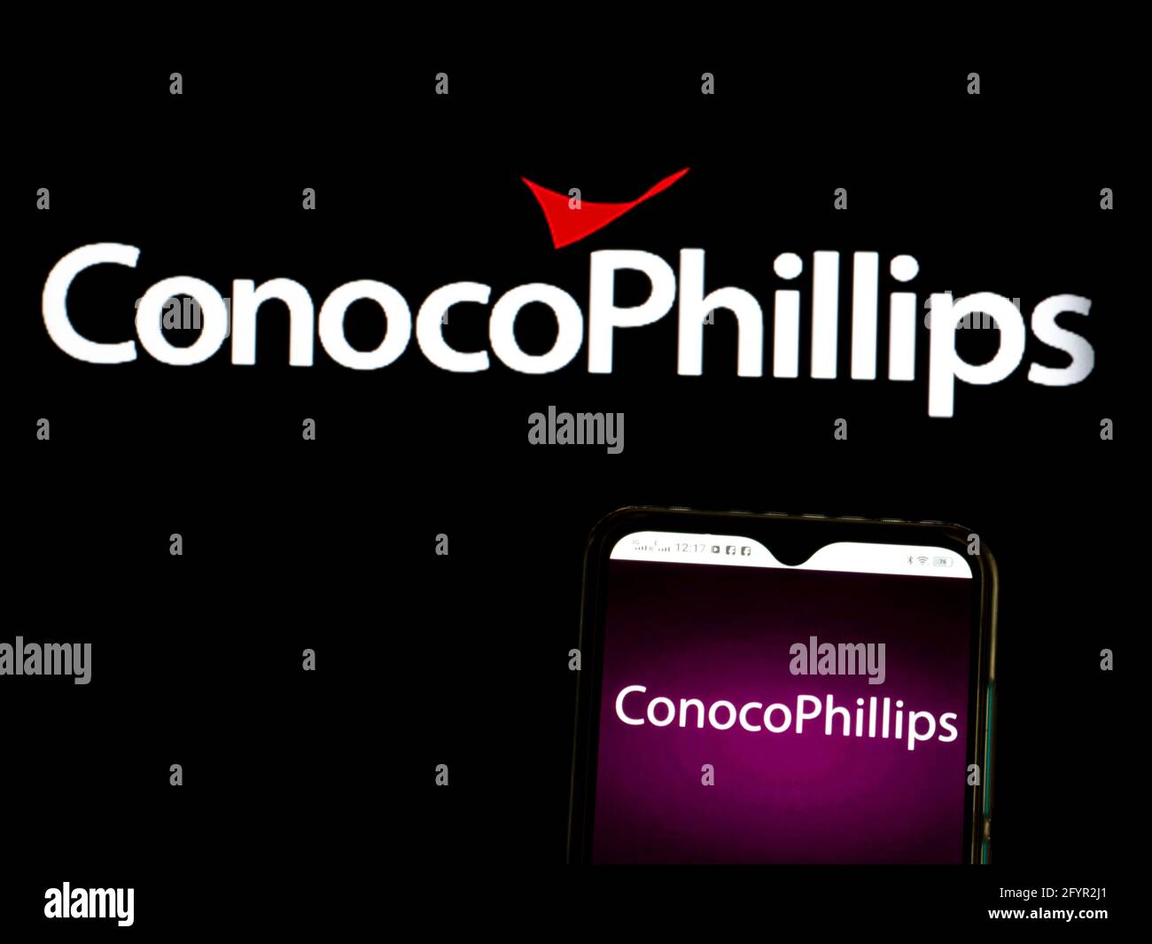 In this photo illustration, a ConocoPhillips Company logo seen displayed on a smartphone. (Photo ...