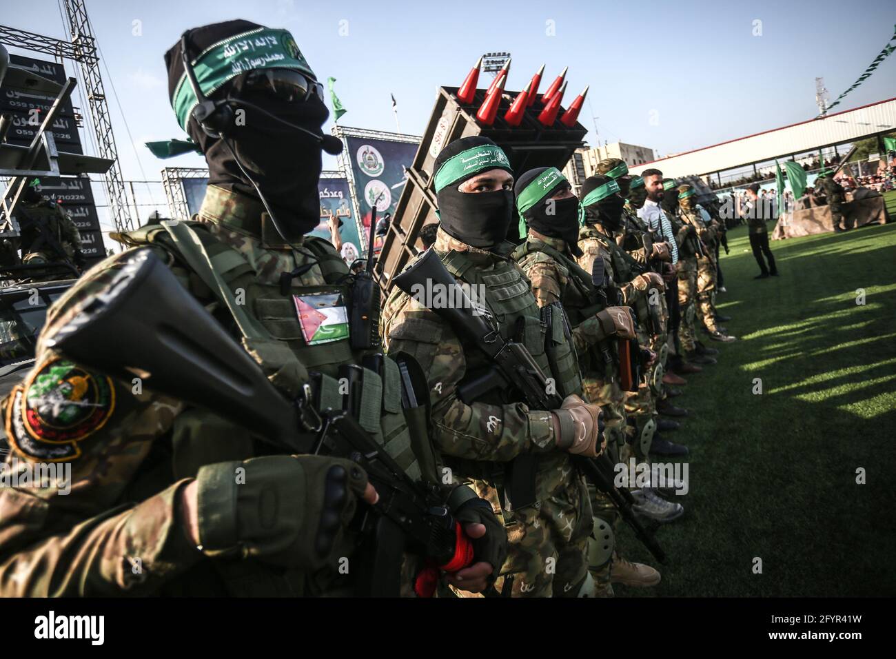 Masked gunmen from the Izz al-Din al-Qassam Brigades take part during ...