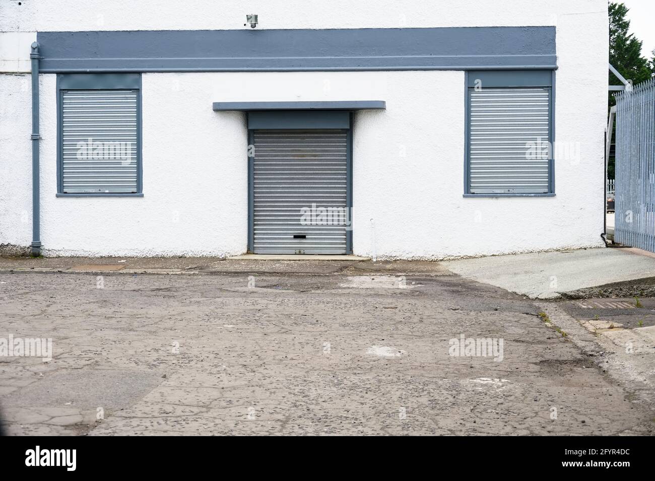 Shop front with blank sign and closed shutter door Stock Photo - Alamy
