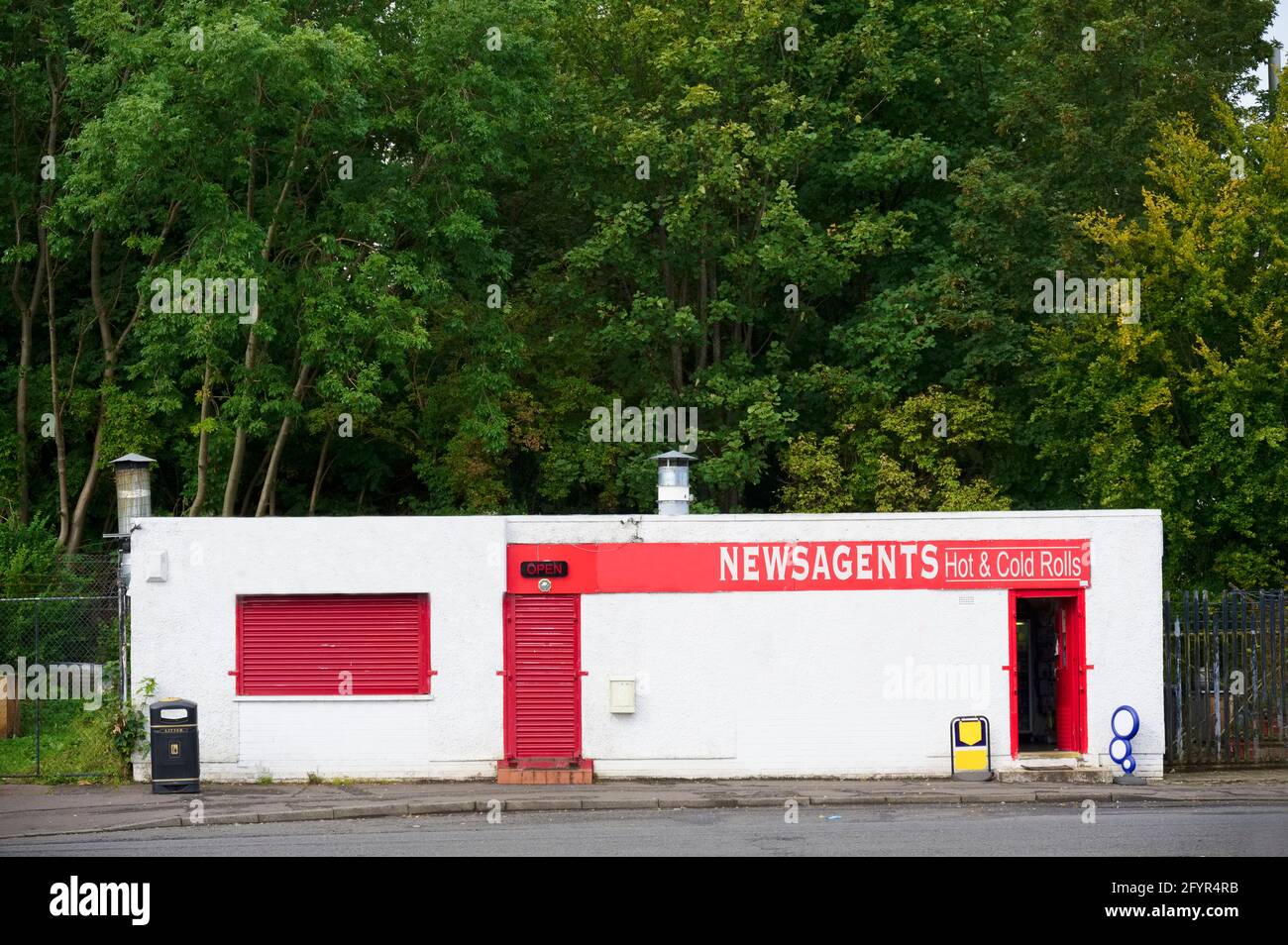 Shop front with blank sign and closed shutter door Stock Photo - Alamy