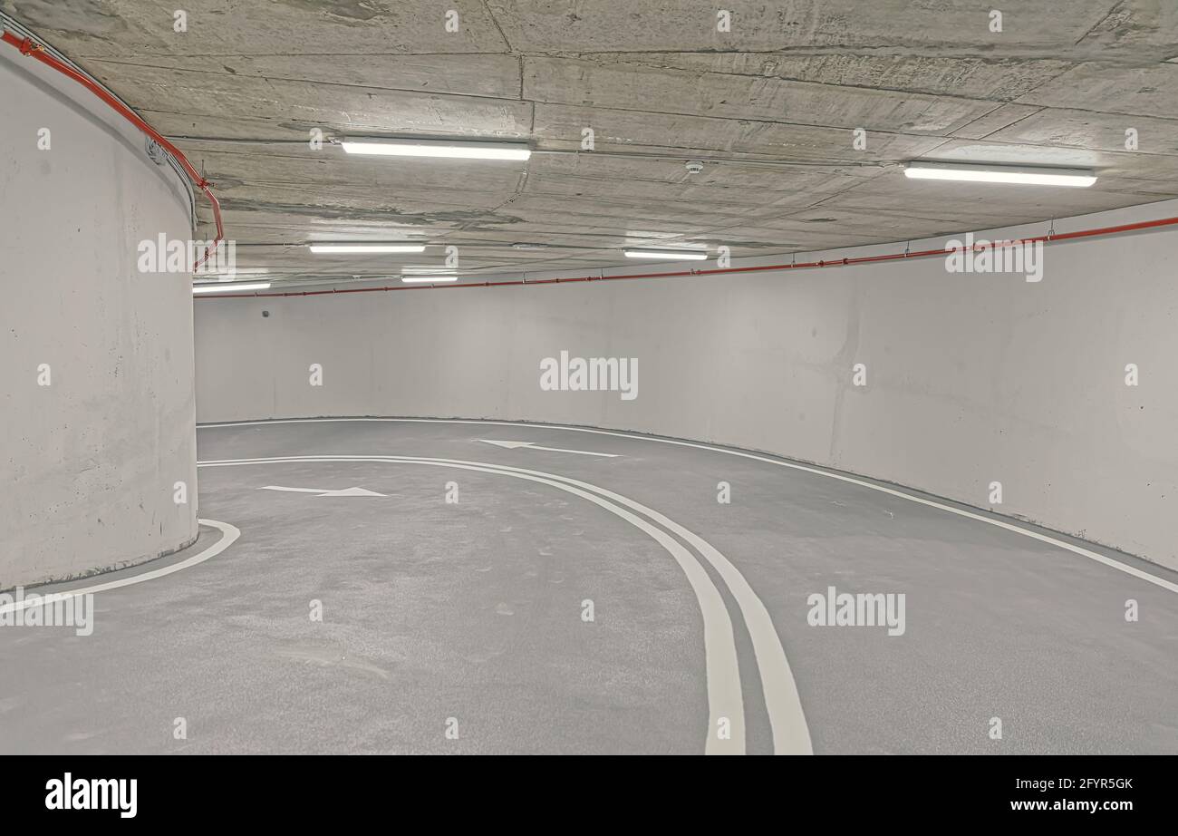 Underground garage interior Stock Photo - Alamy