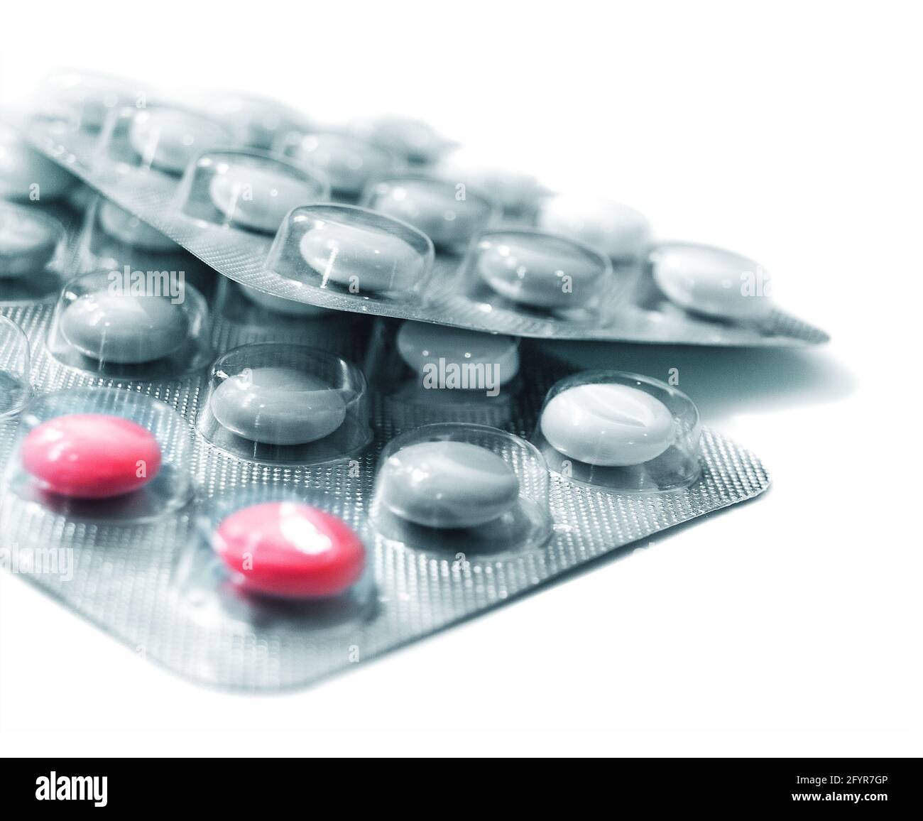 Colored tablets packs, isolated red Stock Photo - Alamy