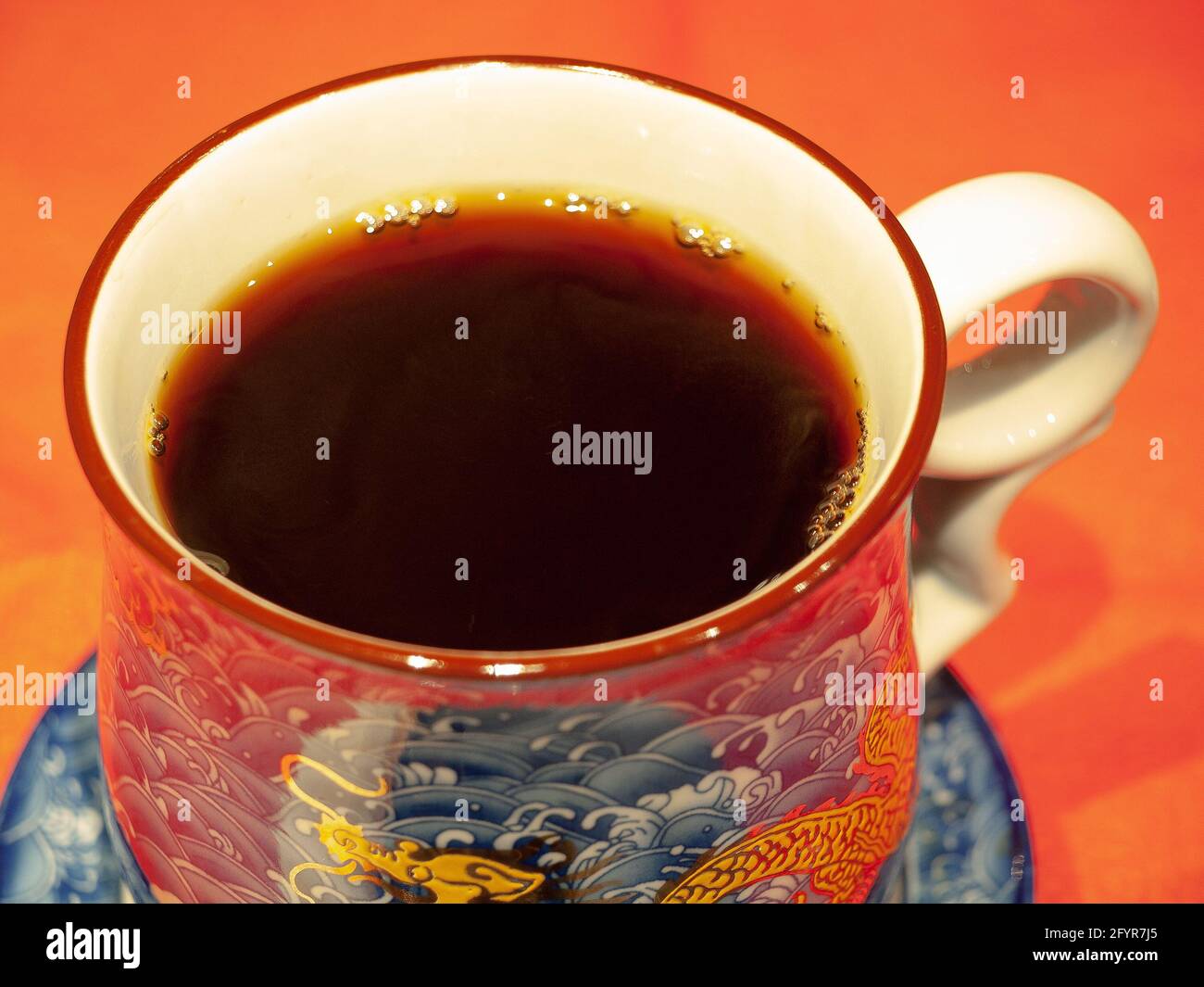 chinese tea cup, on red Stock Photo - Alamy
