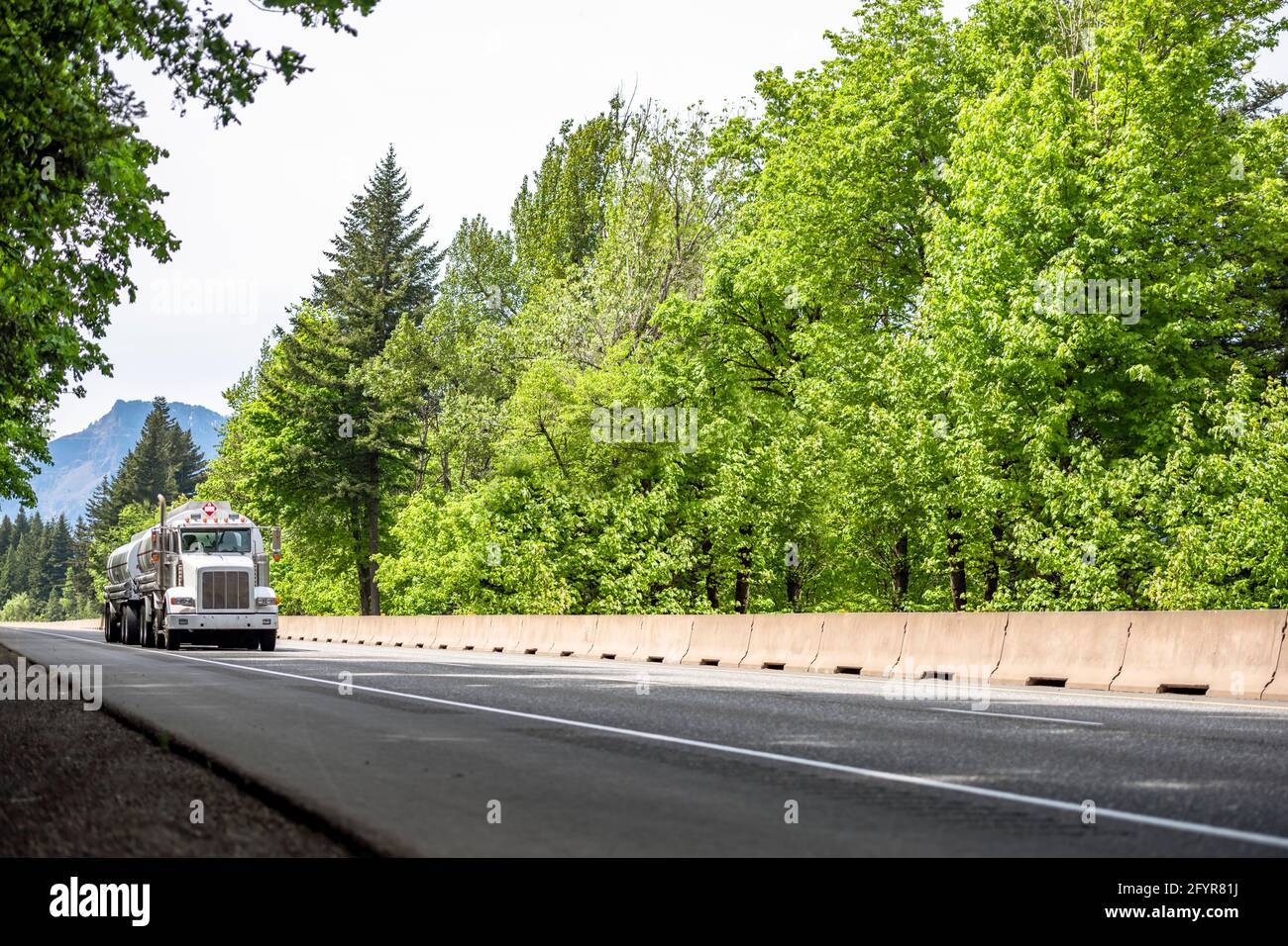 White low profile big rig industrial semi truck tractor transporting ...