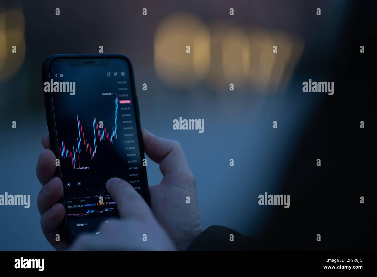 Checking stock market on smartphone hi-res stock photography and images ...