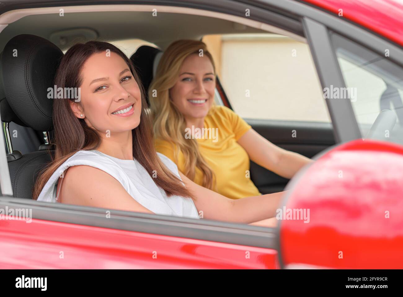 Young beautiful women in the car. Happy lady inside the car Stock Photo ...
