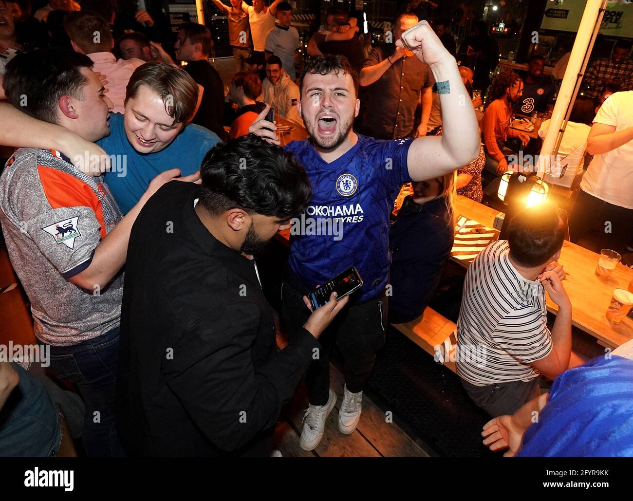 Chelsea fans celebrate after the final whistle at BOXPARK Shoreditch in ...