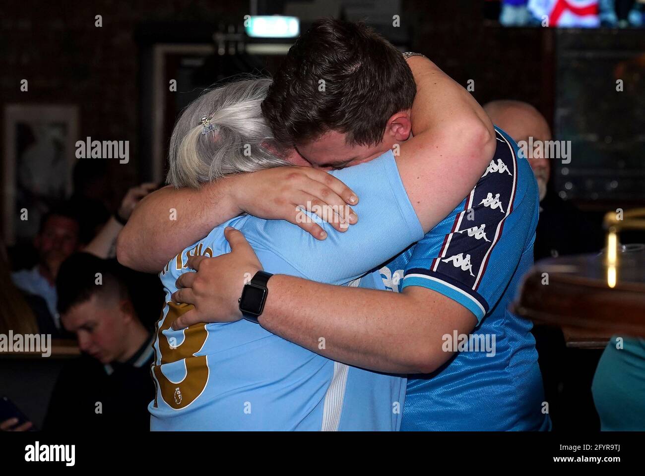 Manchester City fans console each other after the final whistle at the ...