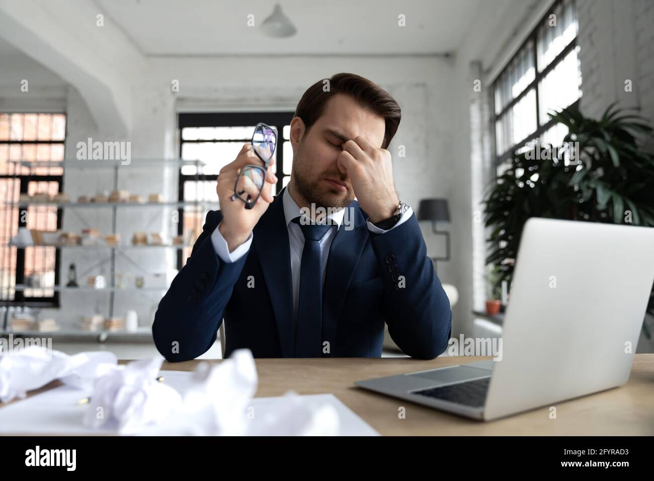 Tired manager overload with paperwork, feeling fatigue Stock Photo - Alamy