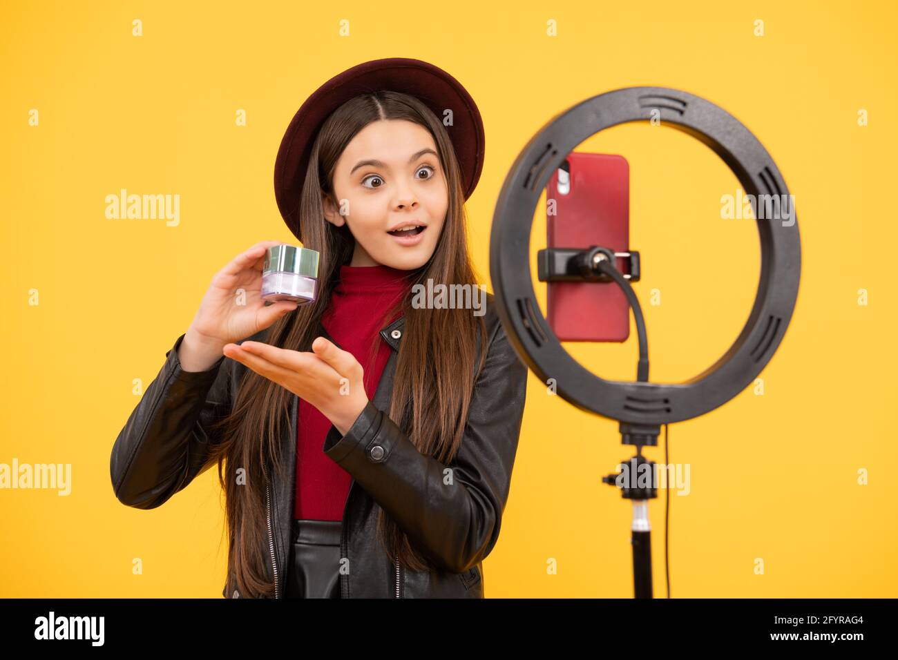 kid beauty blogger. cheerful child do makeup. vlogger with cosmetics ...