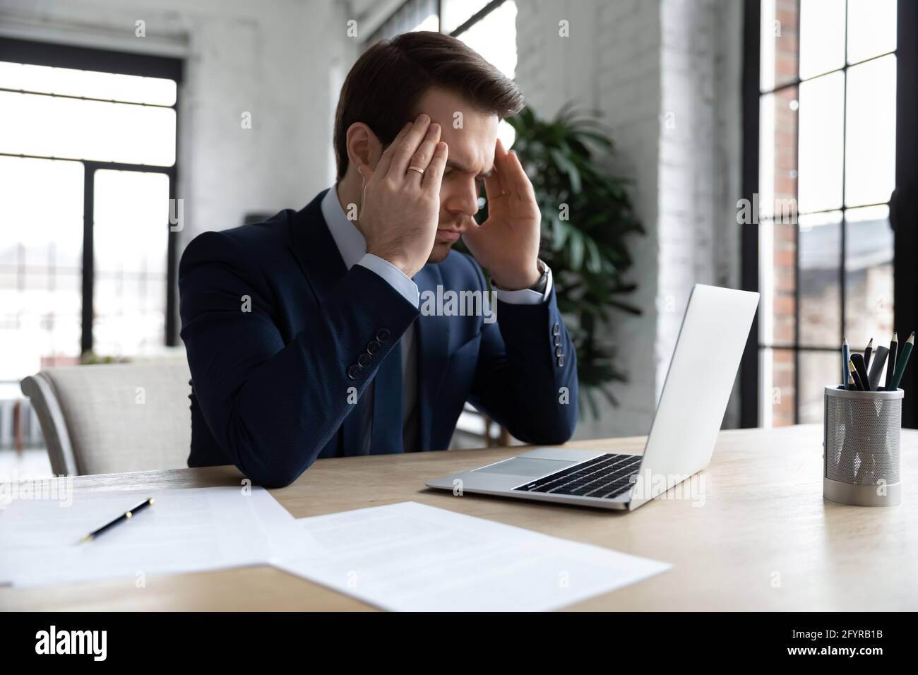 Focused businessman pondering on problem, thinking hard Stock Photo - Alamy