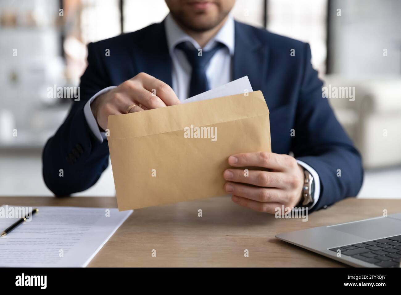 Businessman unpacking document at workplace, opening envelope Stock ...