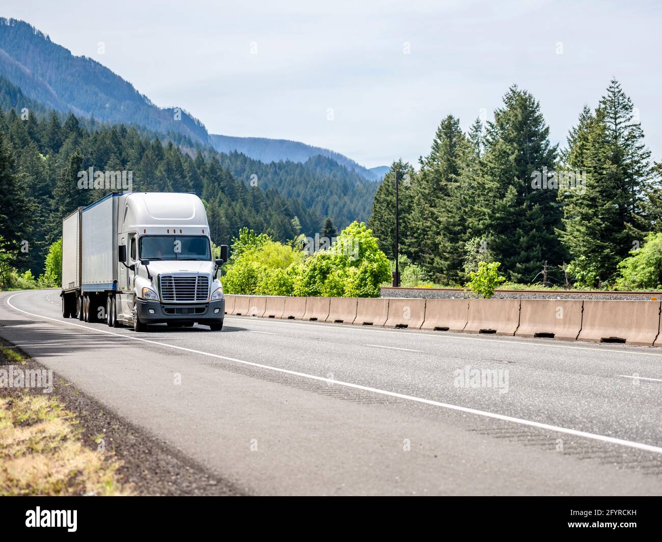 White big rig long haul industrial semi truck tractor transporting ...