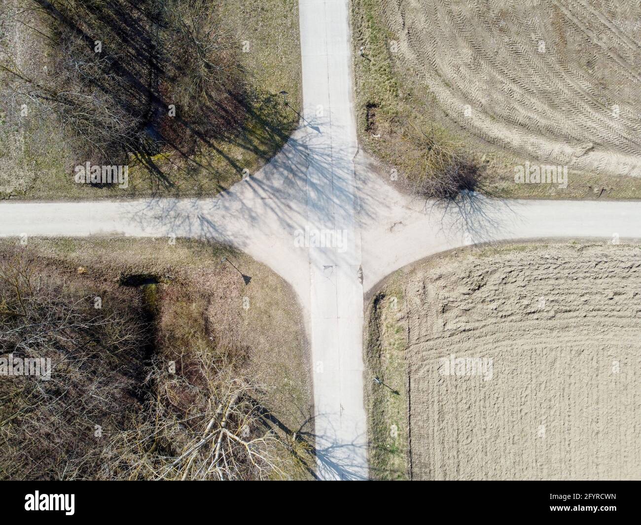 Overhead shot of an intersection in rural area with plains fields and ...