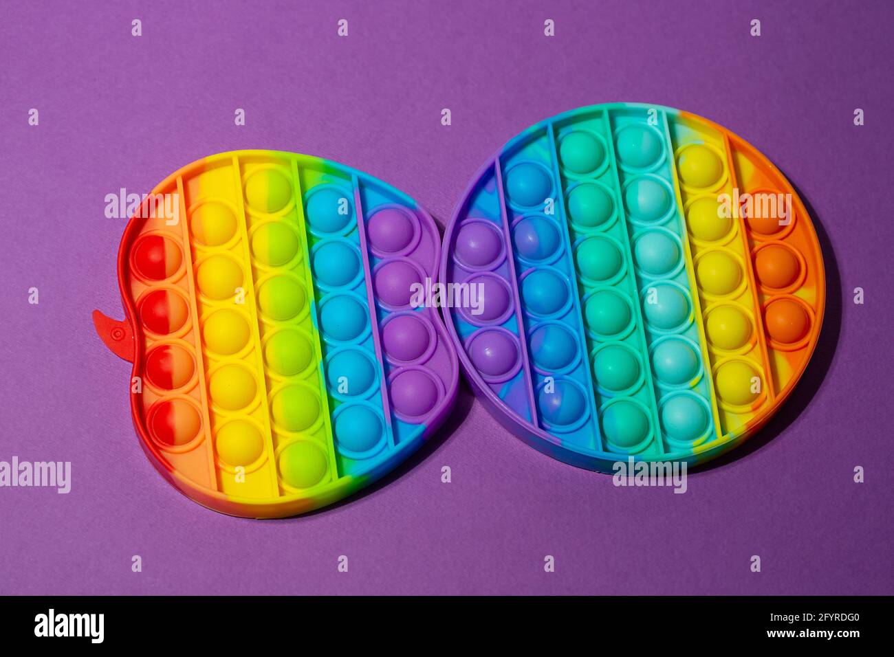 Top view of the sensory toy pop it. New trendy rainbow toy. Colorful ...