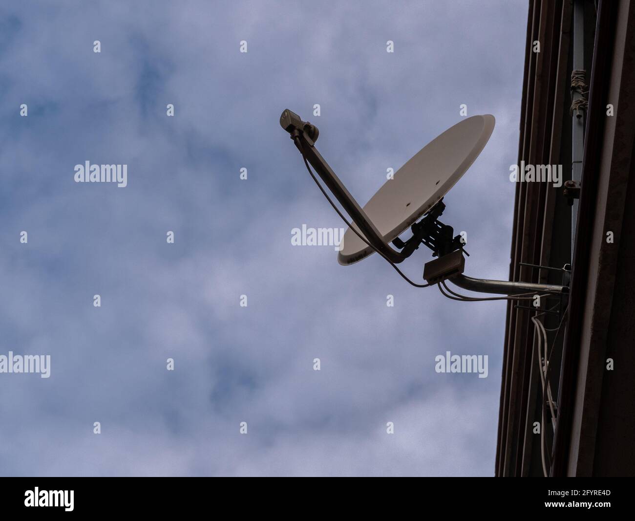 Low angle shot of a satellite dish on a building during daylight Stock ...