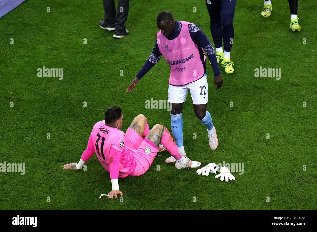 Manchester City's Benjamin Mendy (right) consoles goalkeeper Edison ...