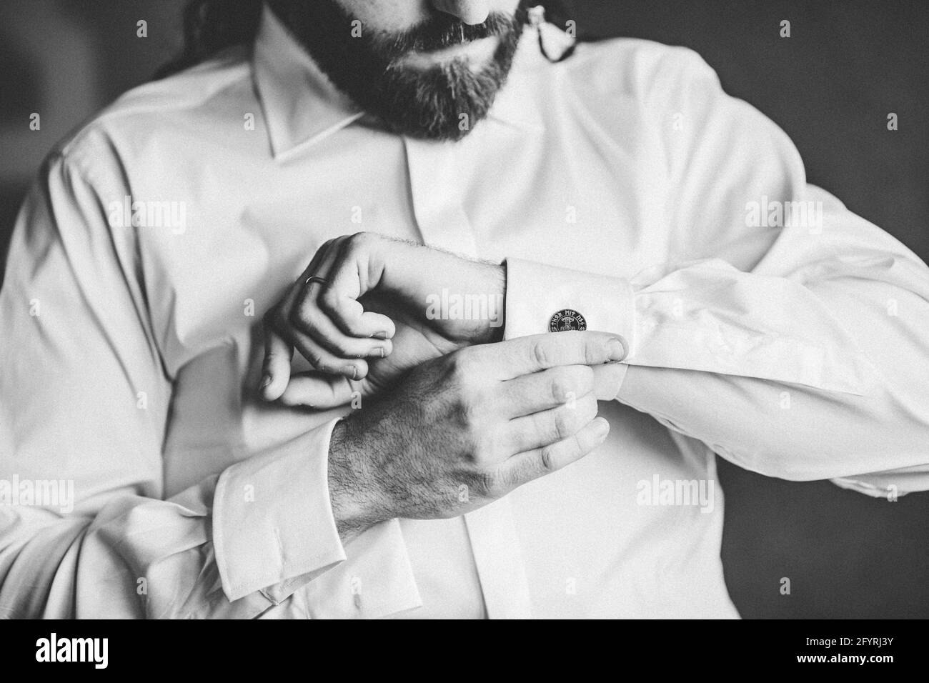White shirt cuffs Black and White Stock Photos & Images - Alamy