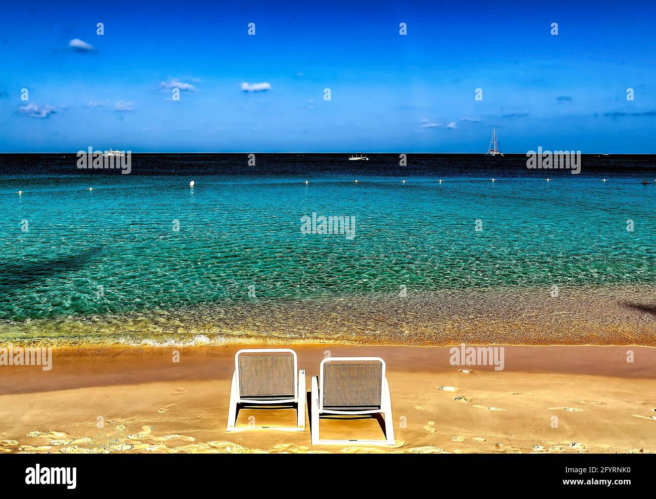 Empty beach scene at a Caribbean resort Stock Photo - Alamy