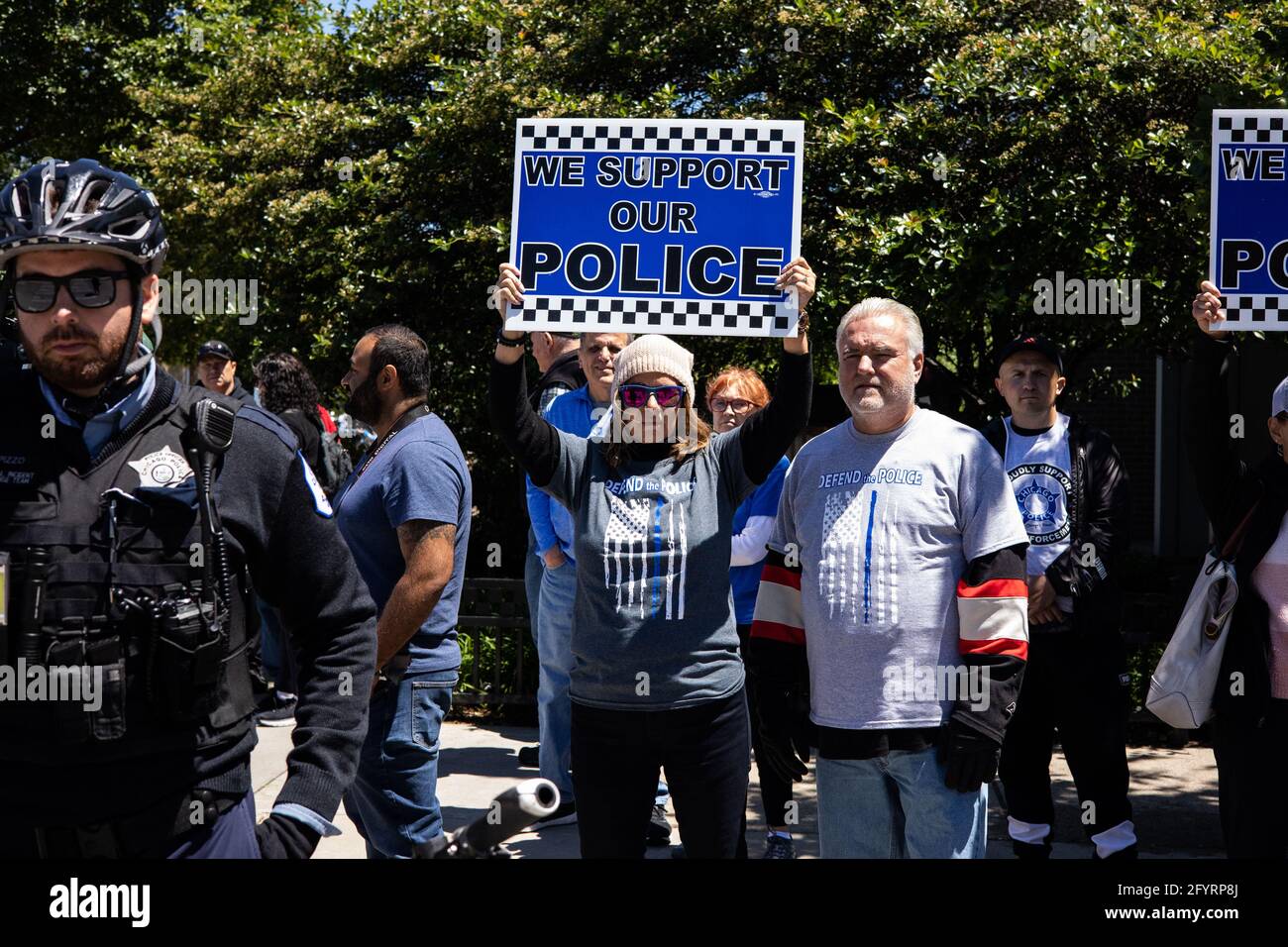 Pro police supporters stage a counter protest across the street from ...