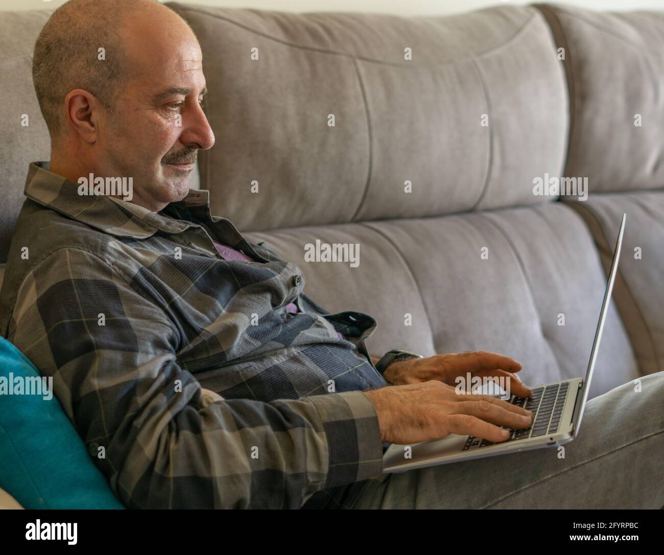 man watching pc and paying online Stock Photo - Alamy