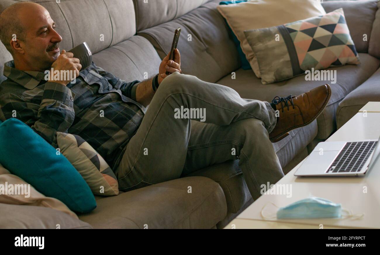 man watching pc and paying online Stock Photo - Alamy
