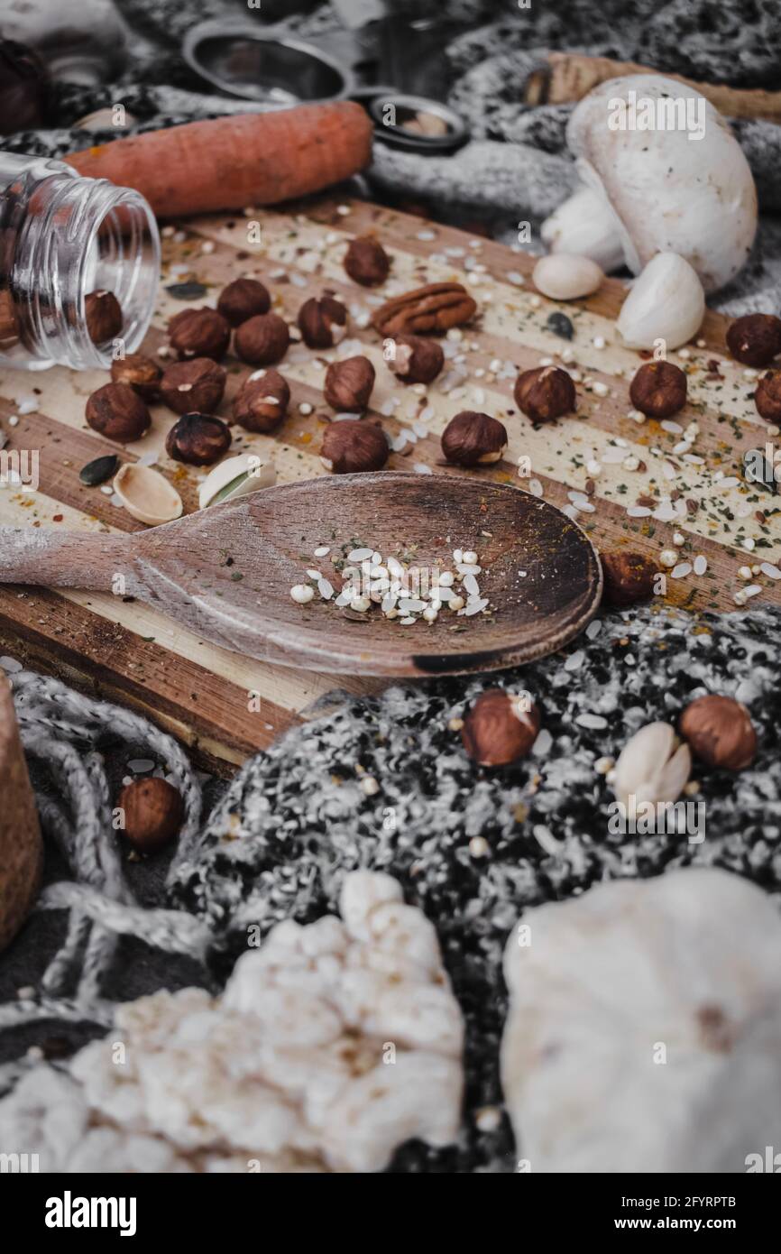 Vertical shot of various spices, seasonings and ingredients on a ...