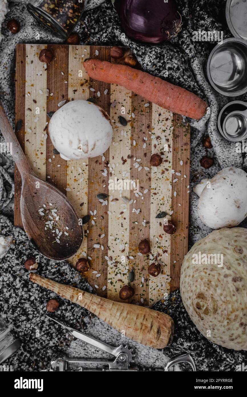 Vertical top view of a messy kitchen table with herbs and spices Stock ...
