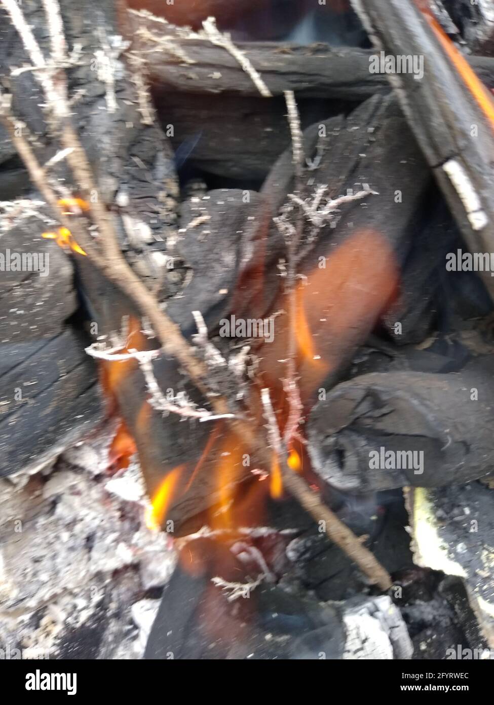 A vertical shot of ash and burning wood in bonfire - perfect for ...