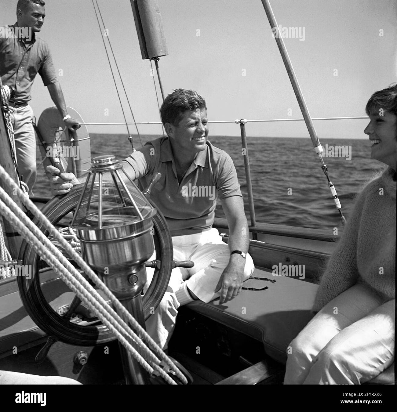 President John F. Kennedy sits aboard the United States Coast Guard ...