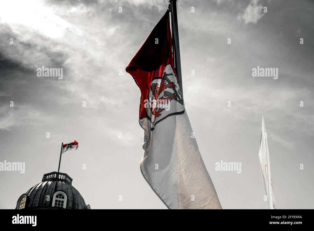 A low angle of Dusseldorf's flag on the pole in background of the ...